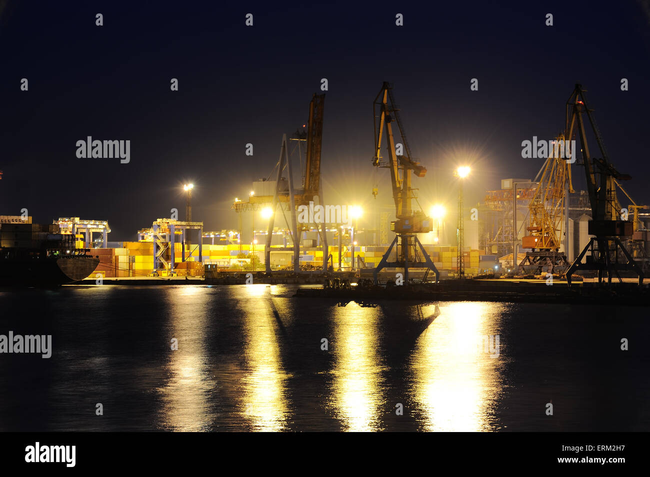 night view of the industrial port with cargoes Stock Photo - Alamy