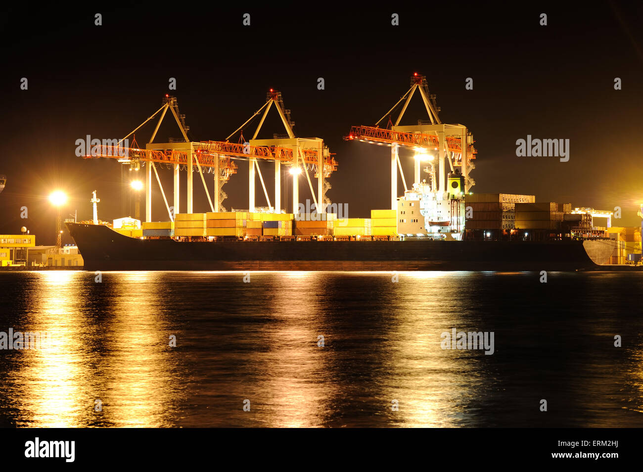 Cargo container ship in port at night Stock Photo - Alamy