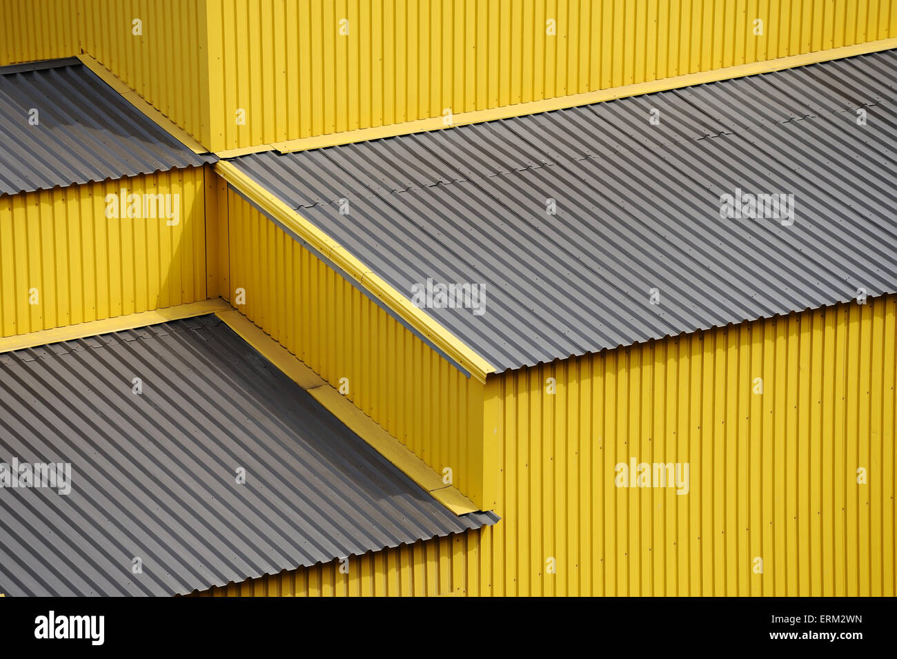 Yellow siding wall and roof as background Stock Photo - Alamy