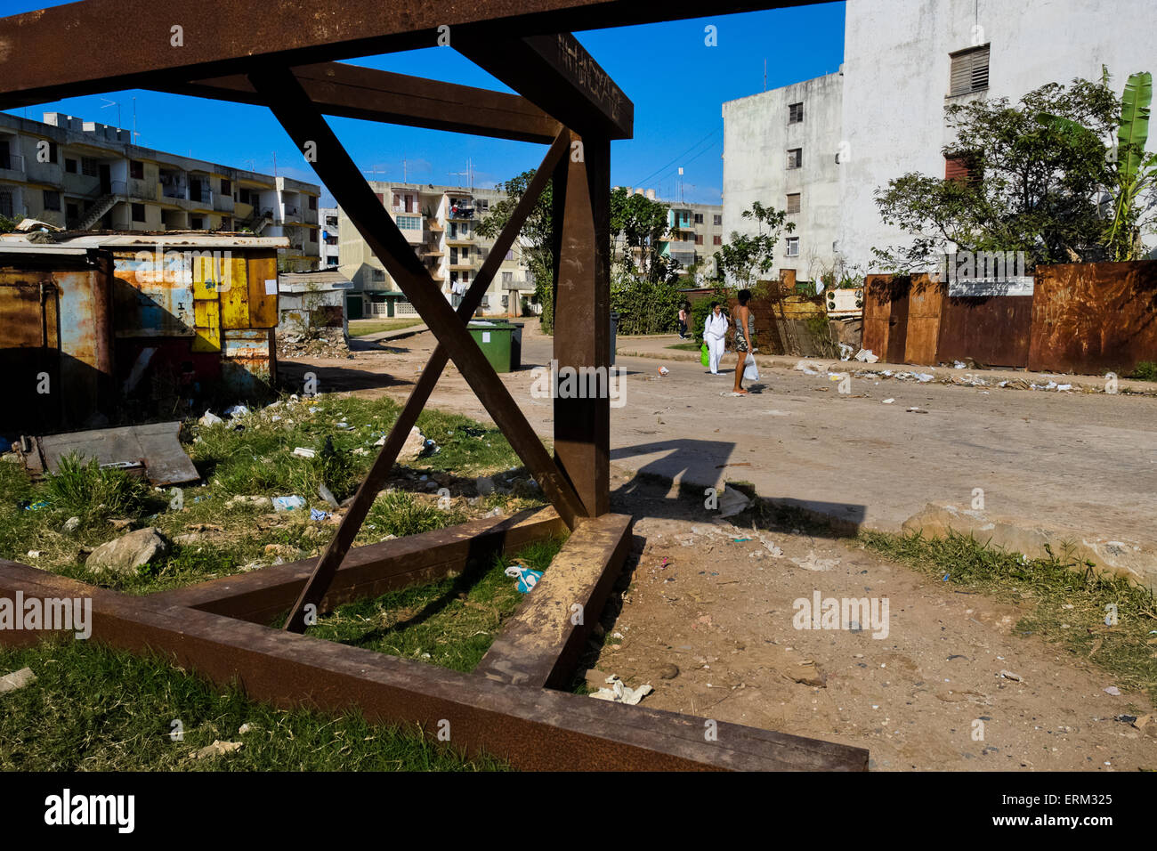 Cuban women walk in front of the large apartment blocks in Alamar, a ...