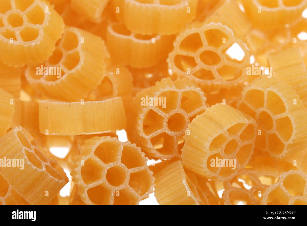Raw pasta isolated on white Stock Photo - Alamy
