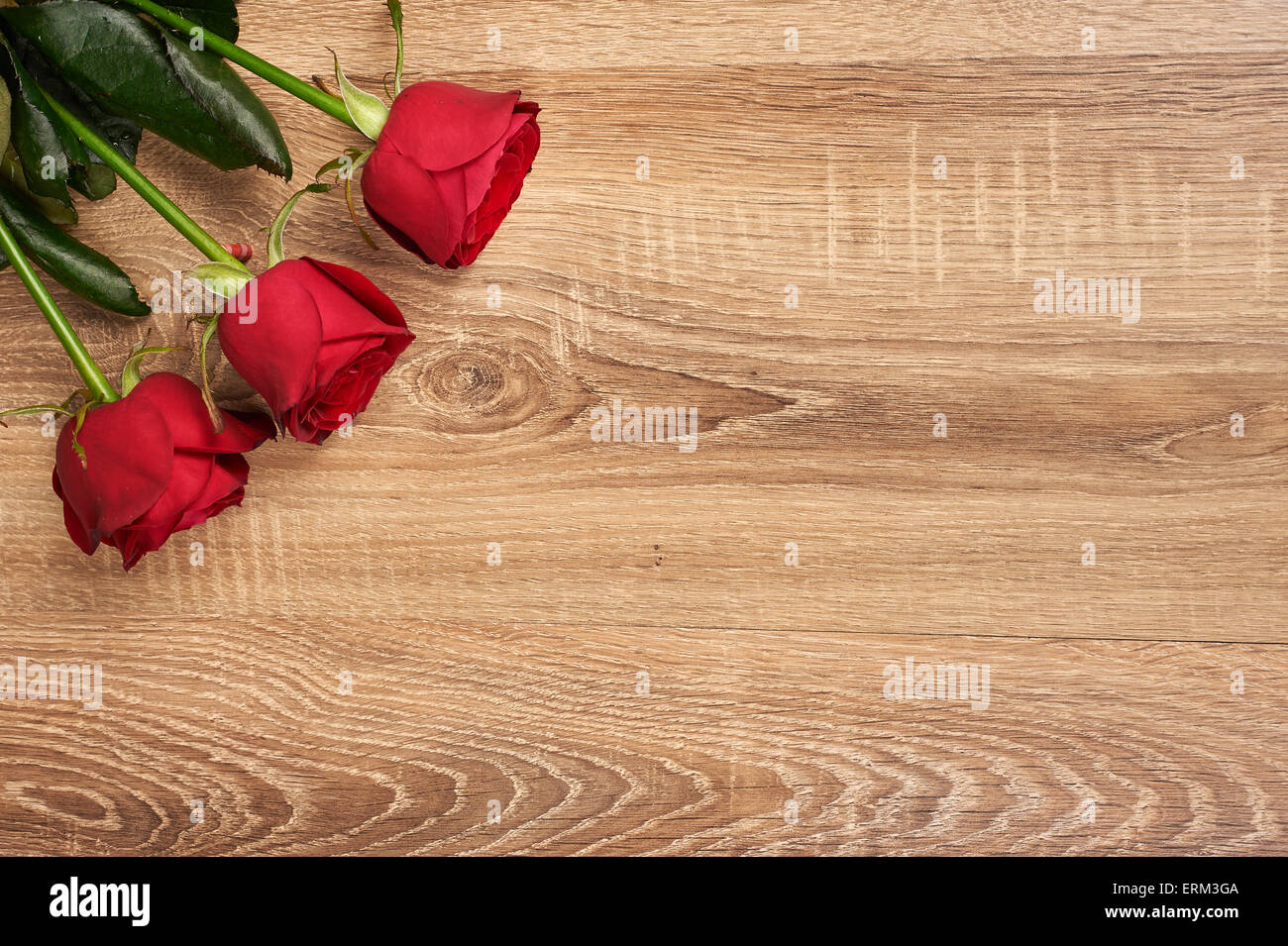 Red rose flower on wood background Stock Photo - Alamy