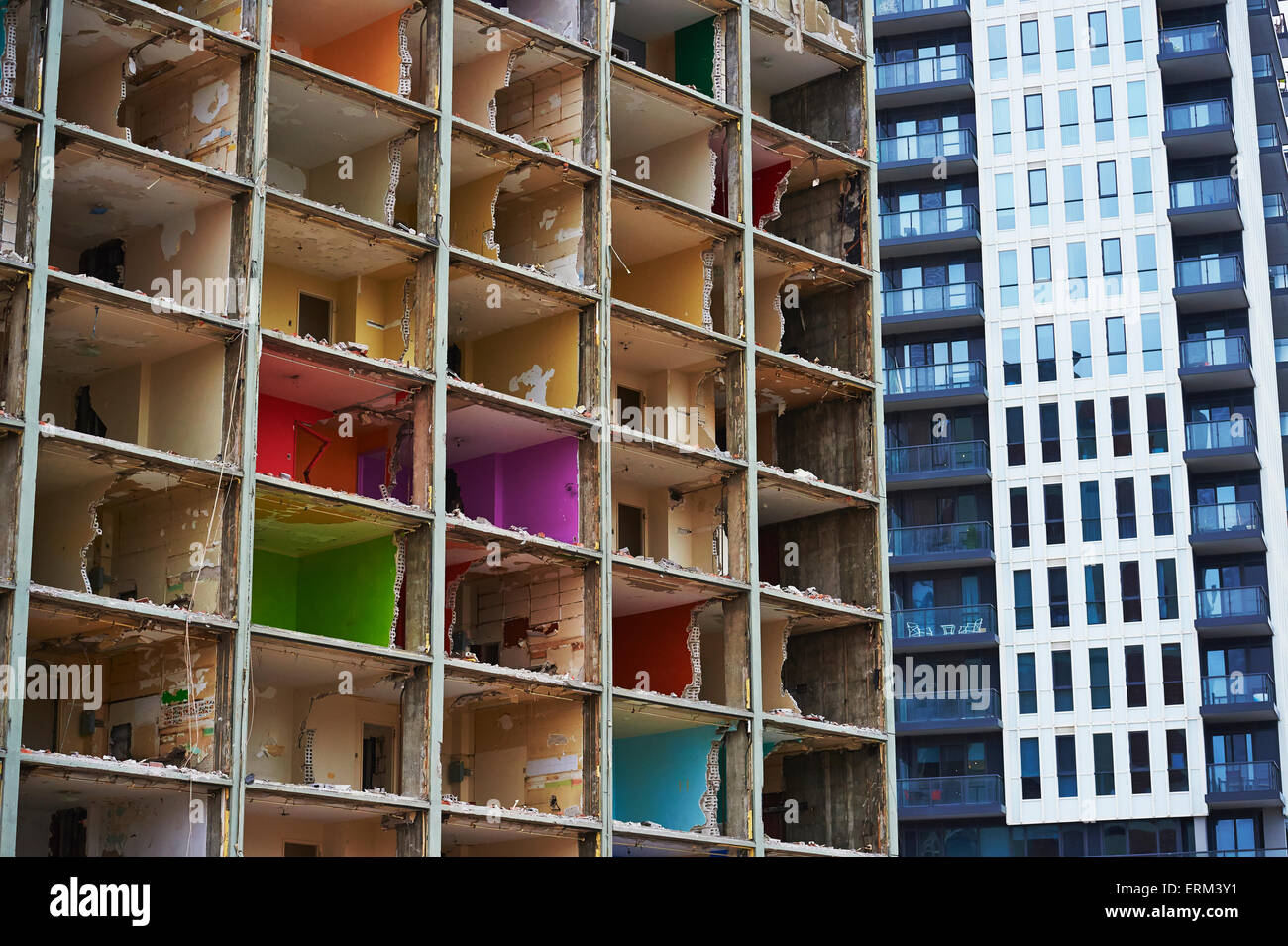 Apartment units without exterior wall under demolition next to new ...