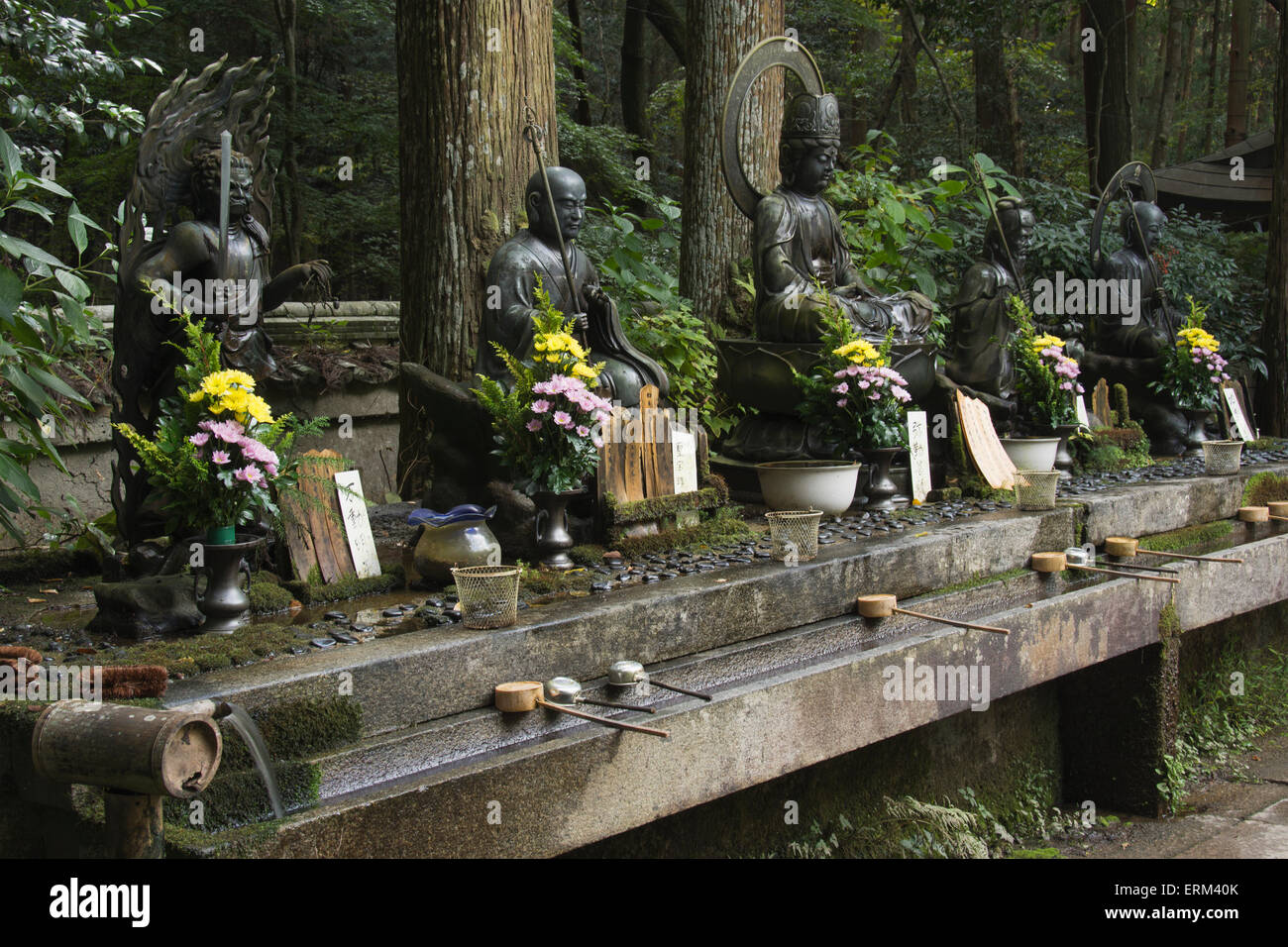 Row of Buddhas and a water basin in a Japanese temple; Kyoto, Japan ...