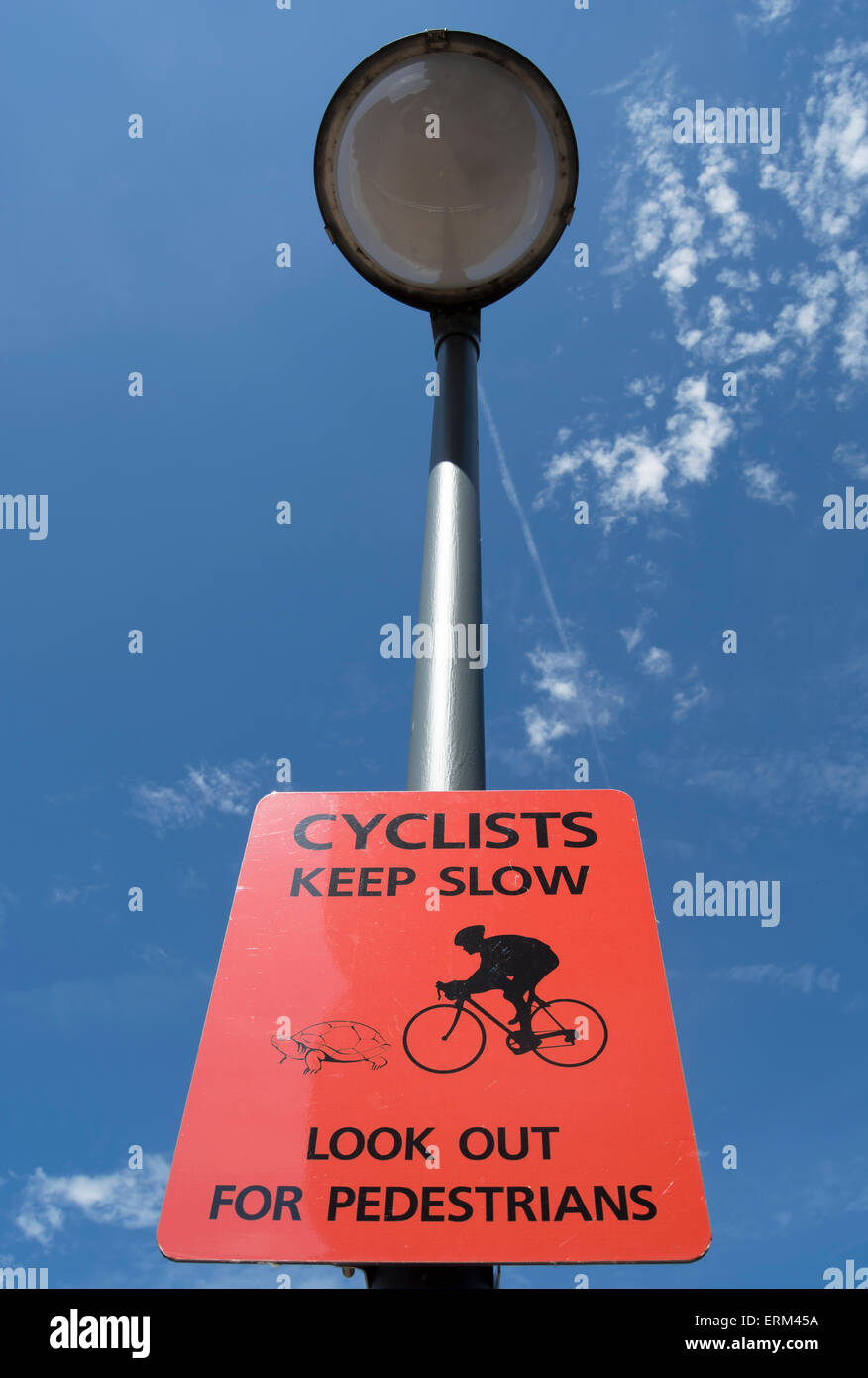 cyclists keep slow sign, with pedestrians depicted as a tortoise, at ...