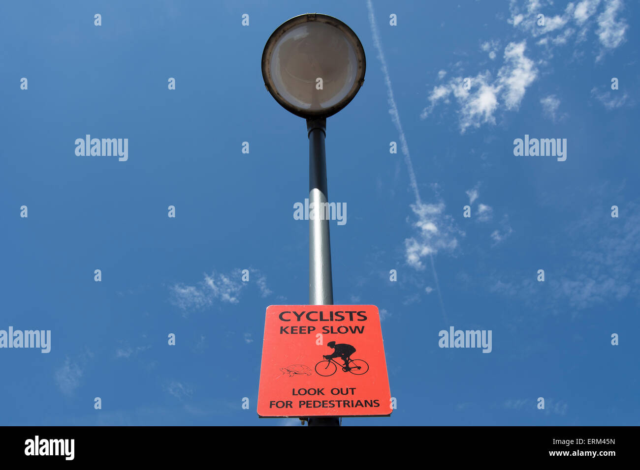cyclists keep slow sign, with pedestrians depicted as a tortoise, at ...