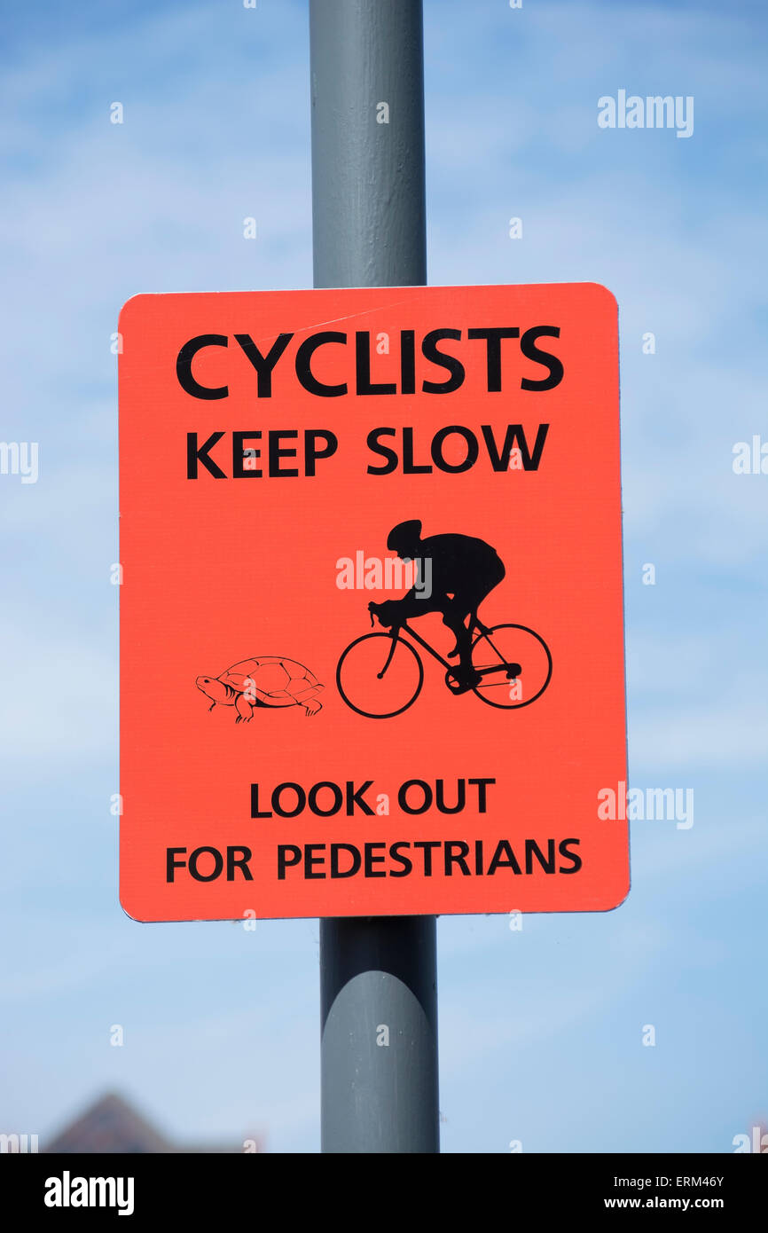 cyclists keep slow sign, with pedestrians depicted as a tortoise, at ...