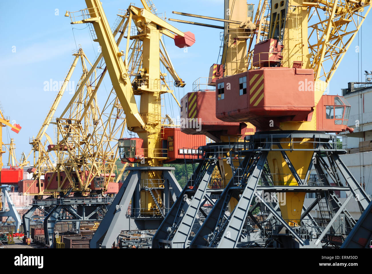 View on trading seaport with cranes, cargoes and ships Stock Photo - Alamy
