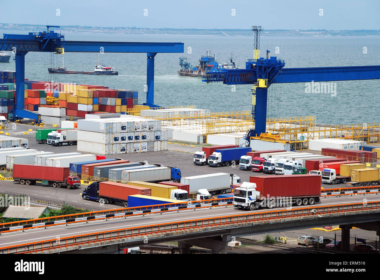 truck carries container. port and sea Stock Photo - Alamy