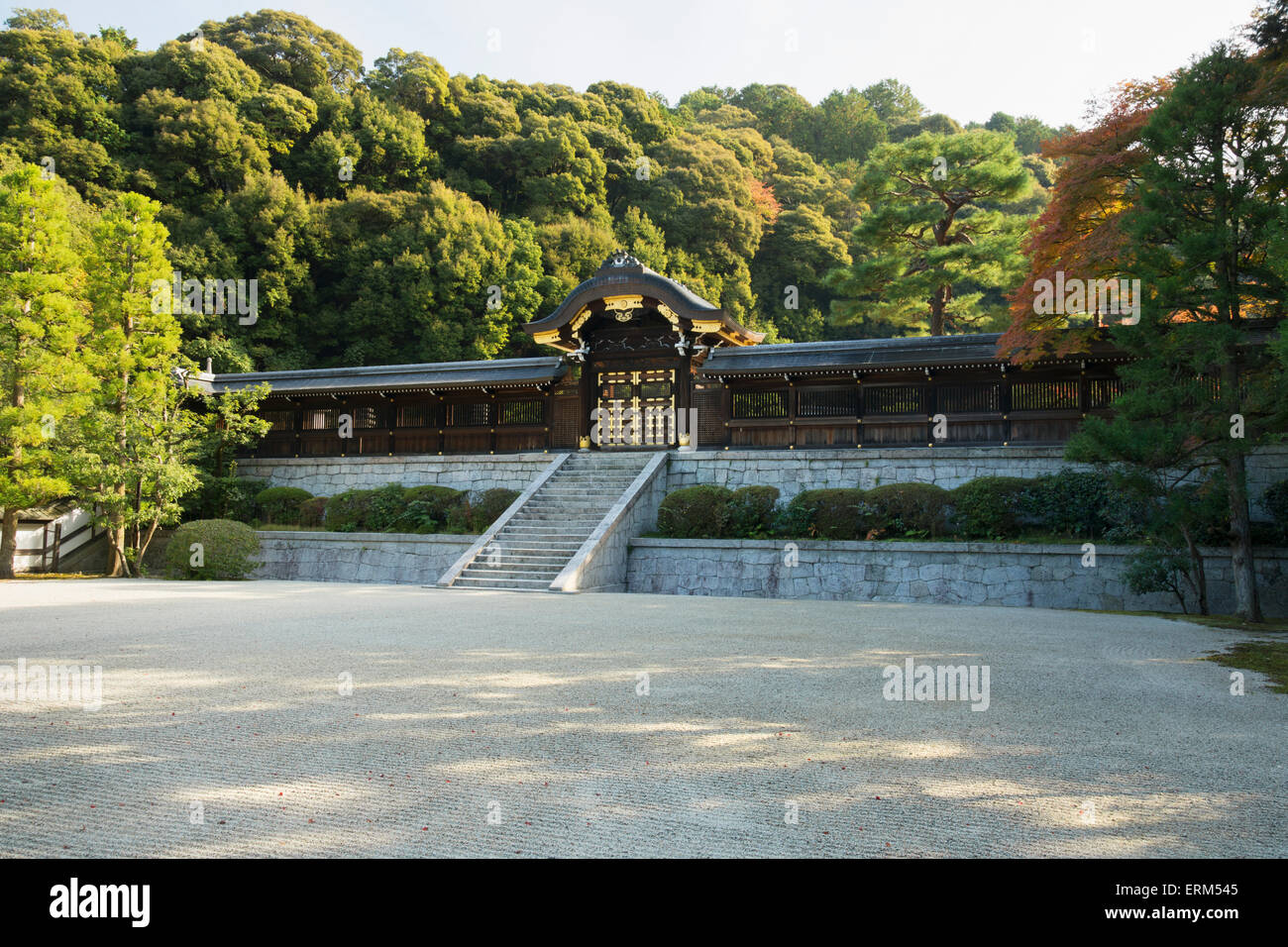 Large Japanese temple wood and stone wall with gate and stone steps ...