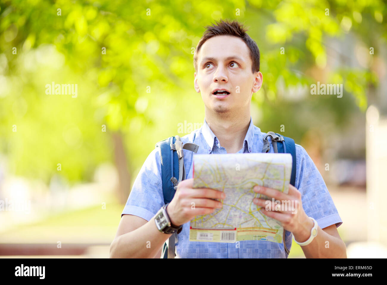 Attractive young man looking map hi-res stock photography and images ...