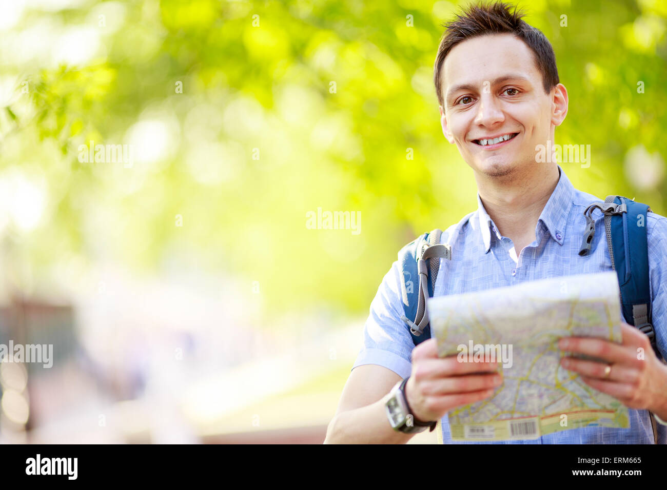 Tourist with map Stock Photo - Alamy