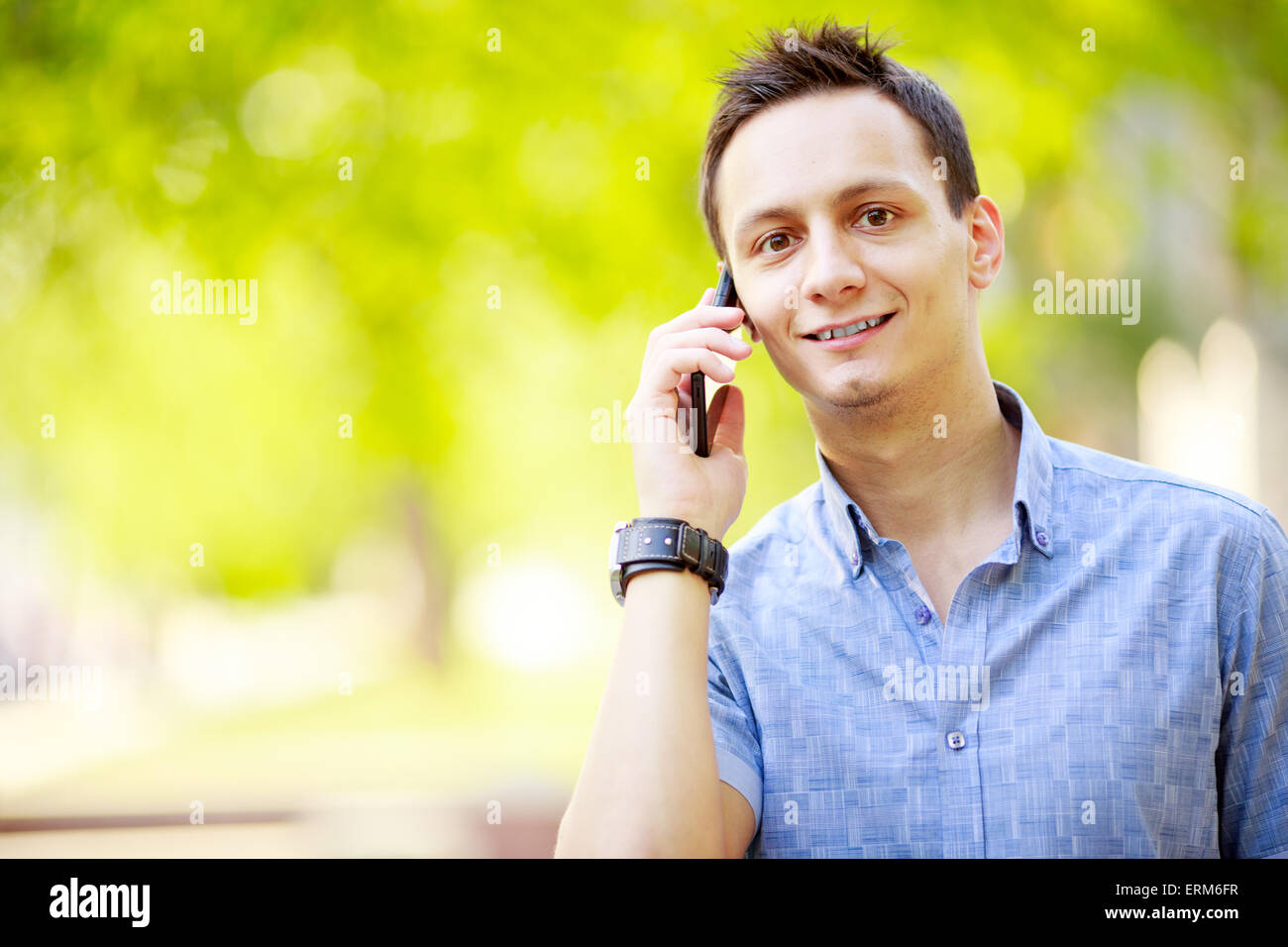 handsome young man talking on the cell phone Stock Photo - Alamy