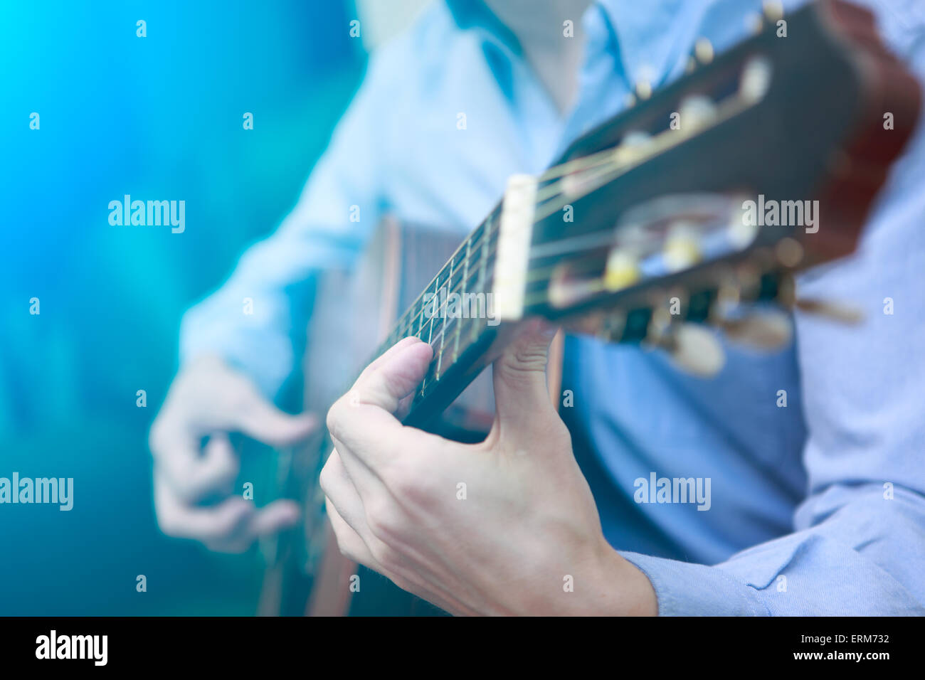Young musician playing at acoustic guitar Stock Photo - Alamy