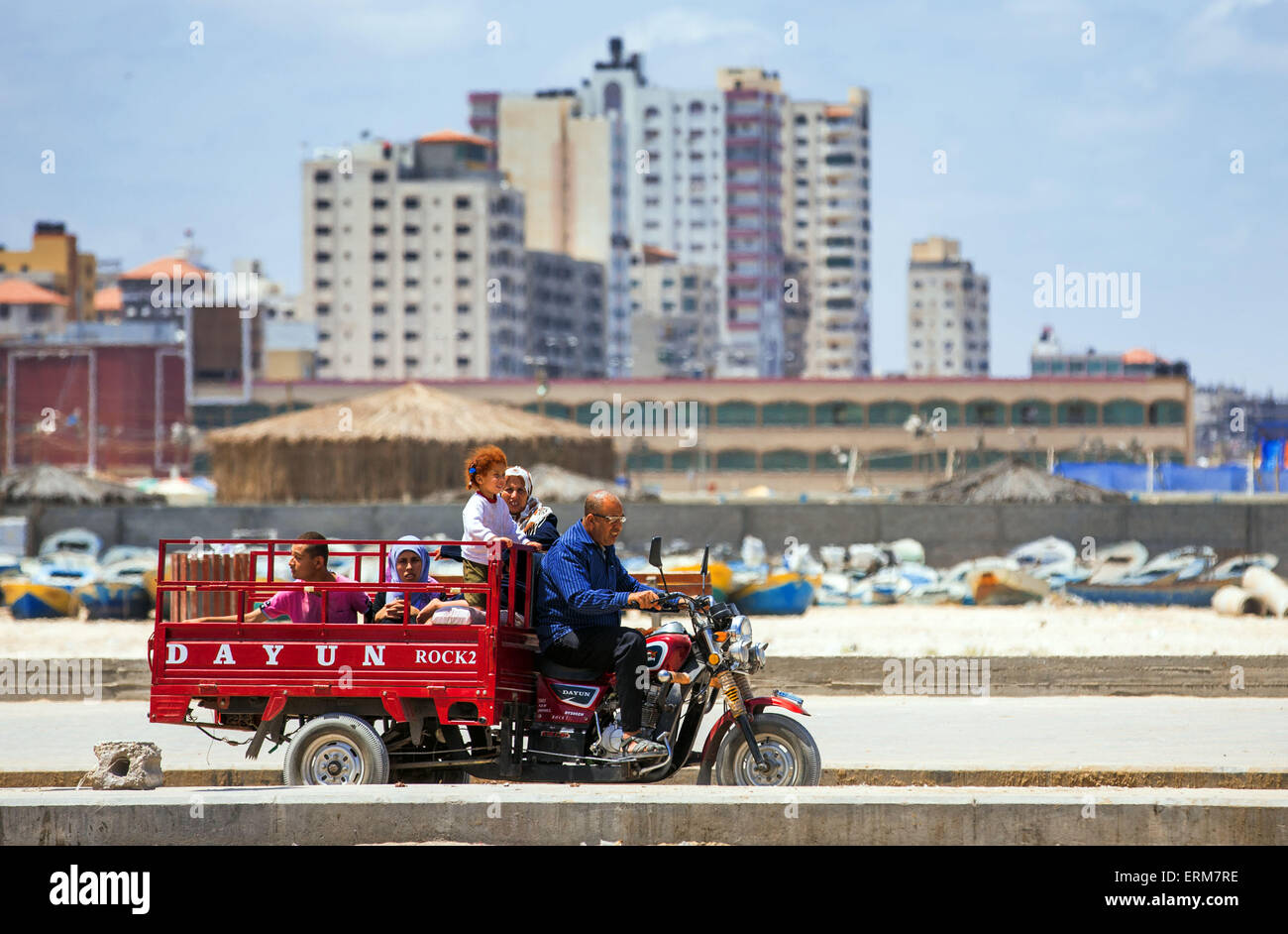 A man drives on the road near the fishing port in Gaza City ...