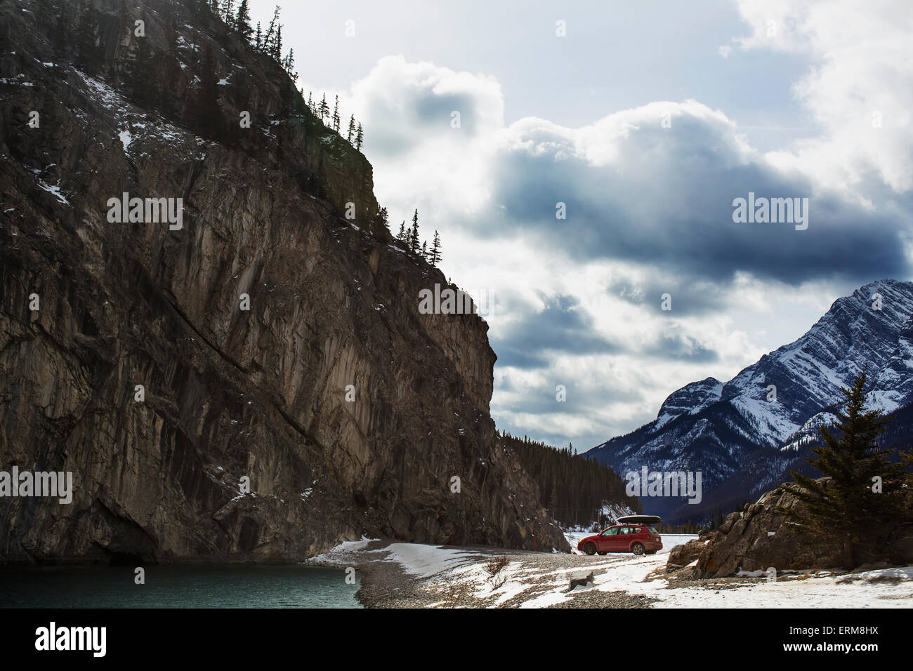Car parked by lake in Spray Valley Provincial Park; Alberta, Canada ...
