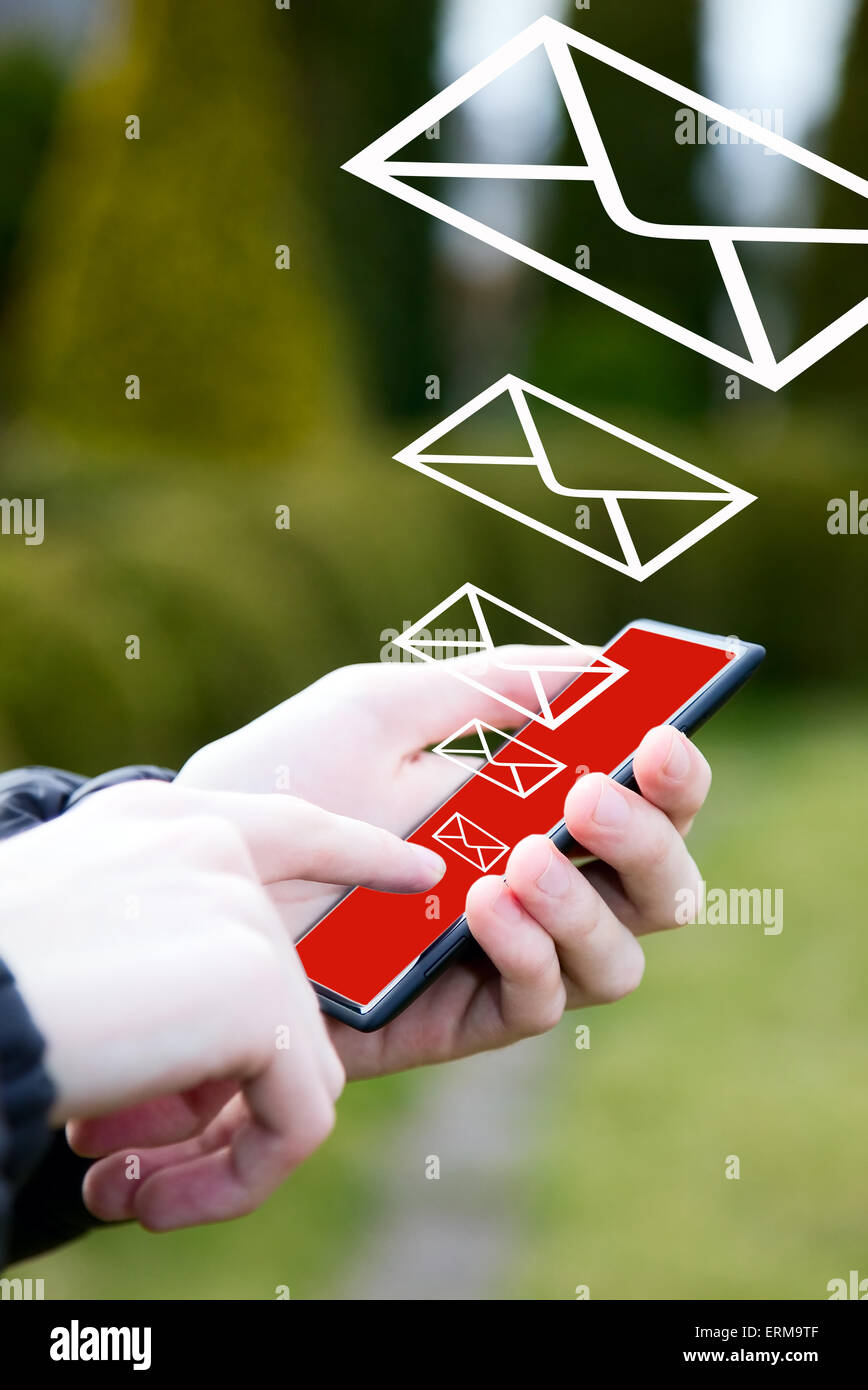 Man is writing email from mobile phone, nature background Stock Photo ...