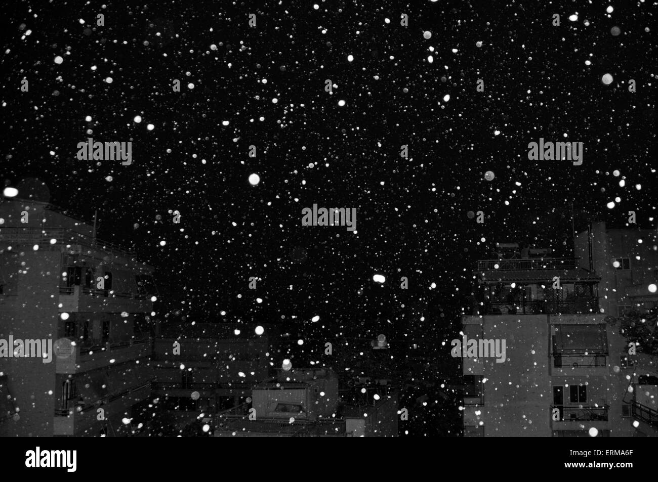 Snow Falling At Night In The City