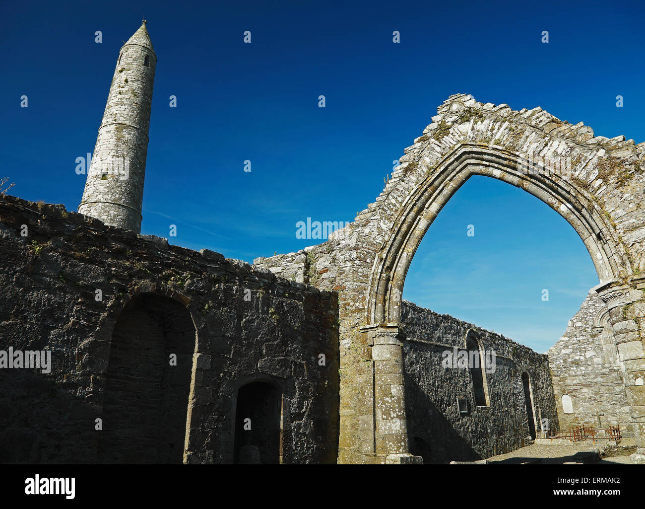 The round tower and ruins of the cathedral in Ardmore village; Ardmore ...