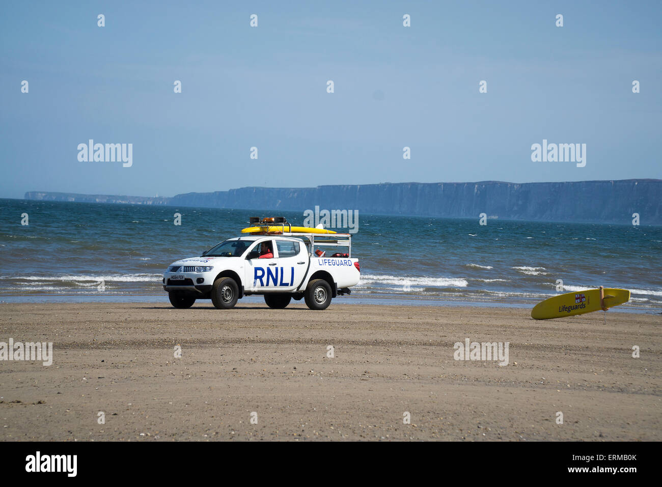 Rnli Patrol on beach at filey North Yorkshire Stock Photo - Alamy