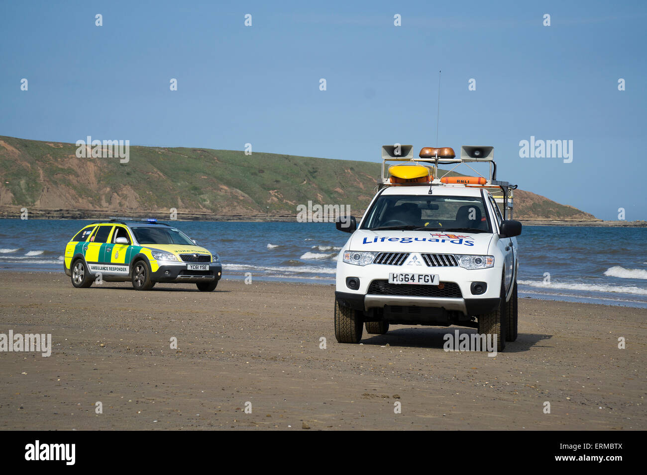 RNLI Lifeguard and Ambulance Service Paramedic in training excercise ...