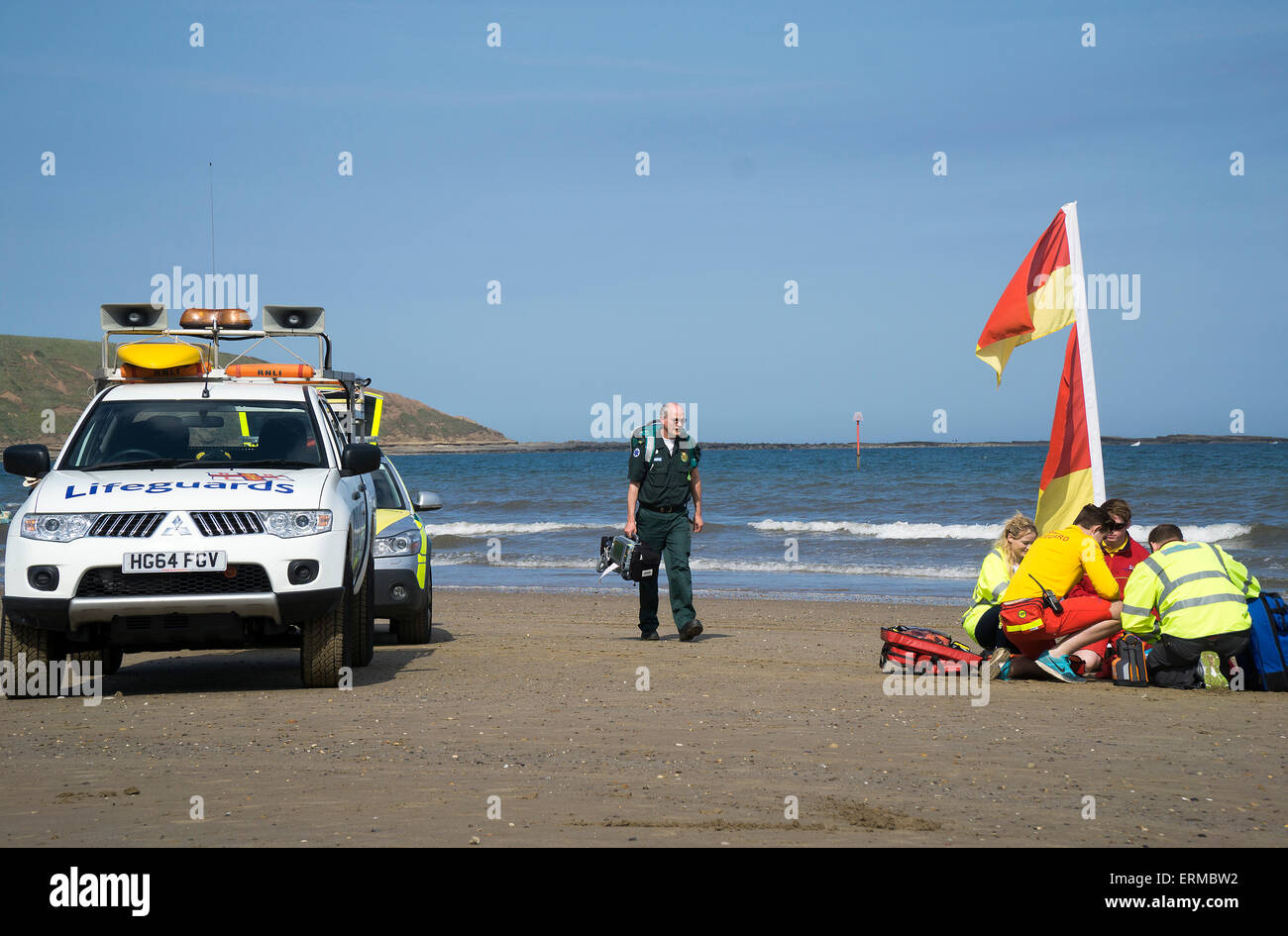 RNLI Lifeguard and Ambulance Service Paramedic in training excercise ...