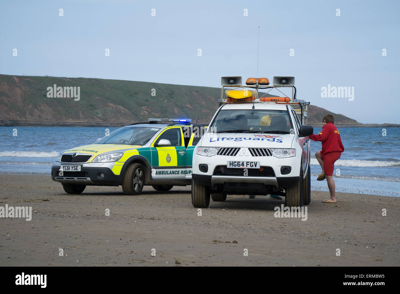 RNLI Lifeguard and Ambulance Service Paramedic in training excercise ...