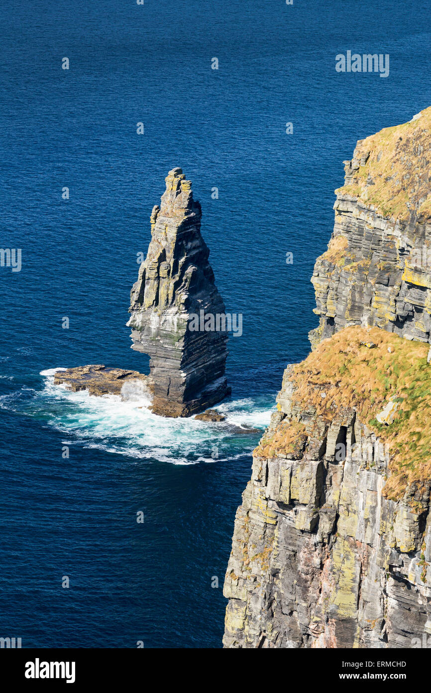 Large sea stack rock structure in the ocean with cliffs; Liscannor ...