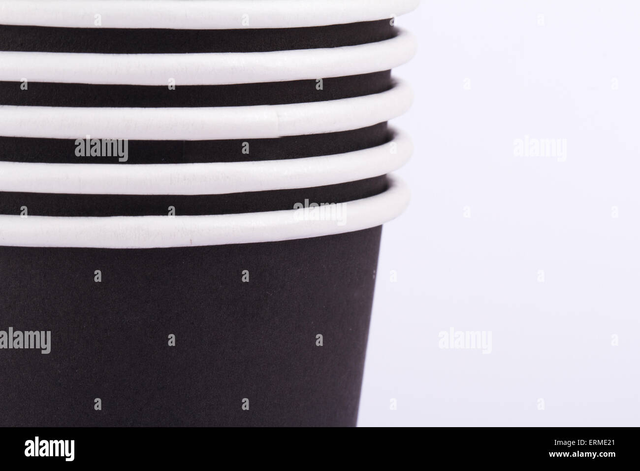 Close up detailed front view of recycled black paper glasses on end ...