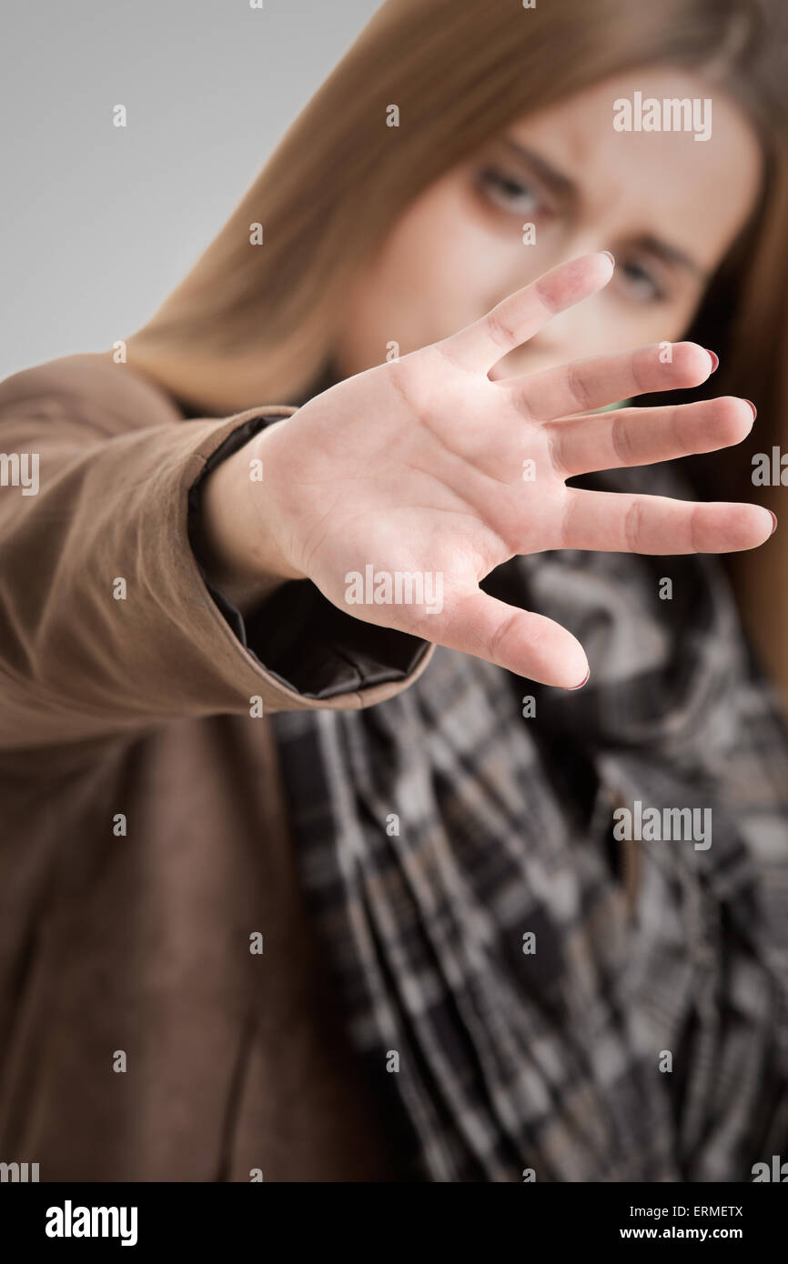 Closeup of a woman protecting herself from an aggressor Stock Photo - Alamy