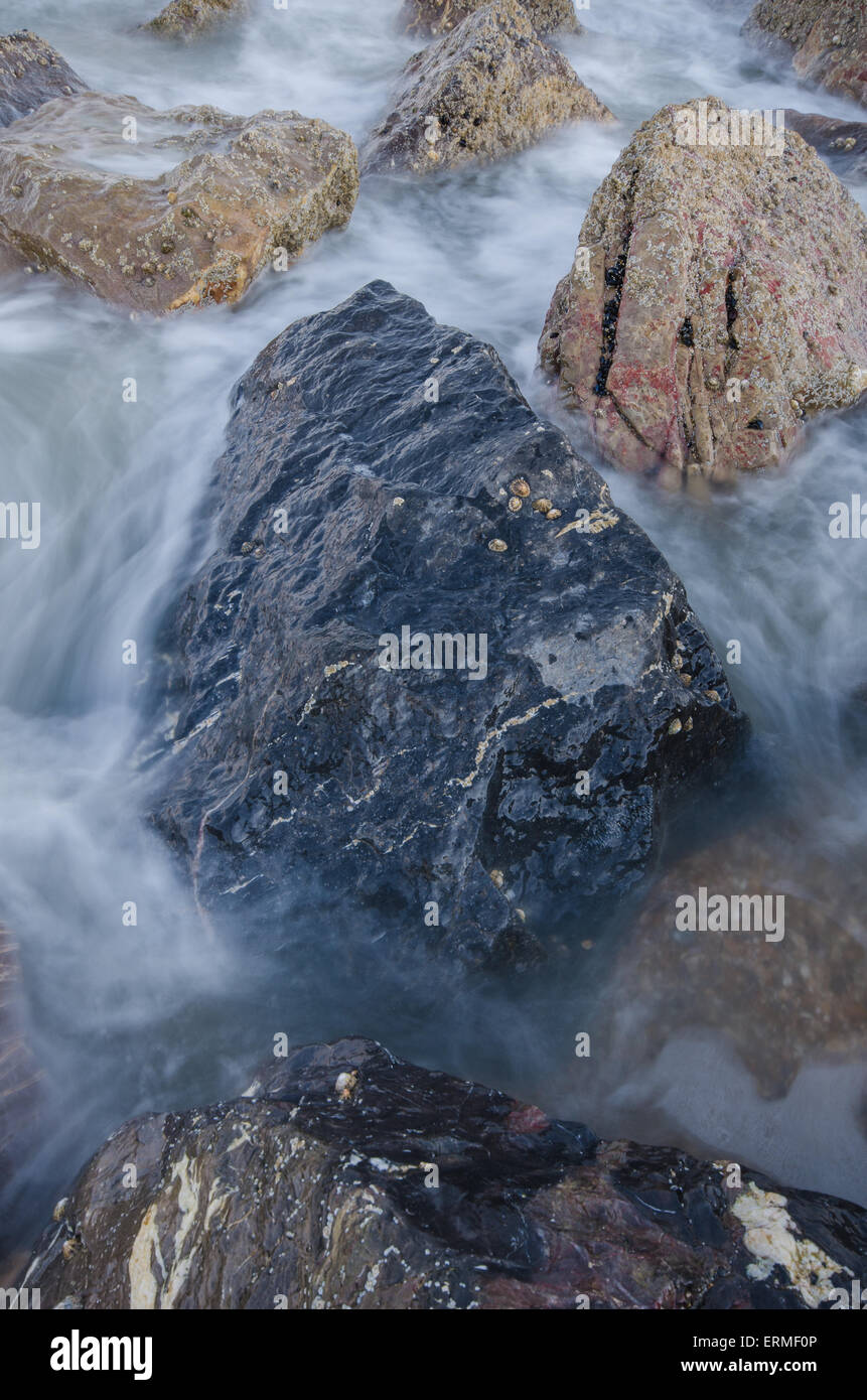 Water splashing on rocks, The Solent, Hayling Island, UK Stock Photo ...