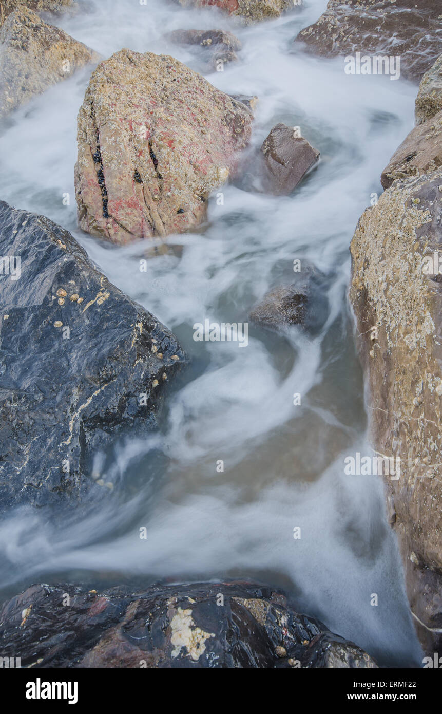Water splashing on rocks, The Solent, Hayling Island, UK Stock Photo ...