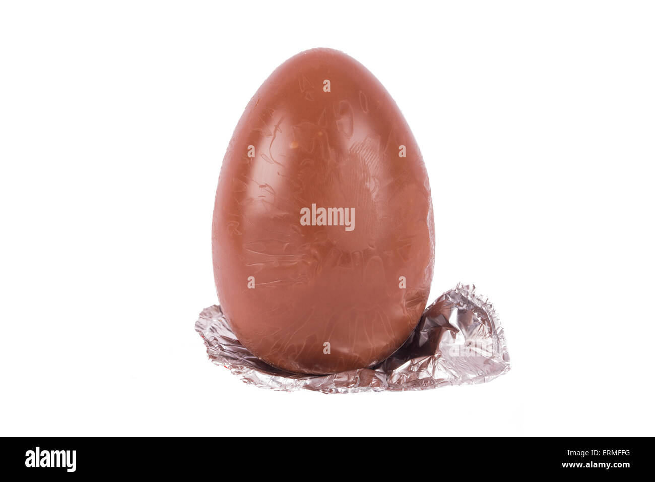 Close up front view of standing milk chocolate egg, isolated on white ...