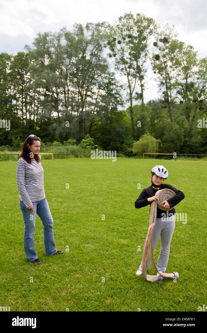 Volunteer firefighters training children Stock Photo - Alamy