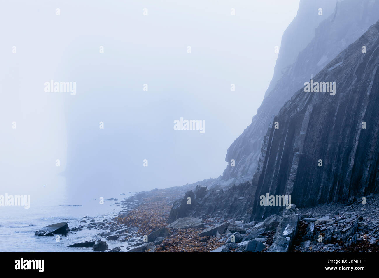 Rock cliff in the fog; Perce, Gaspesie, Quebec, Canada Stock Photo - Alamy