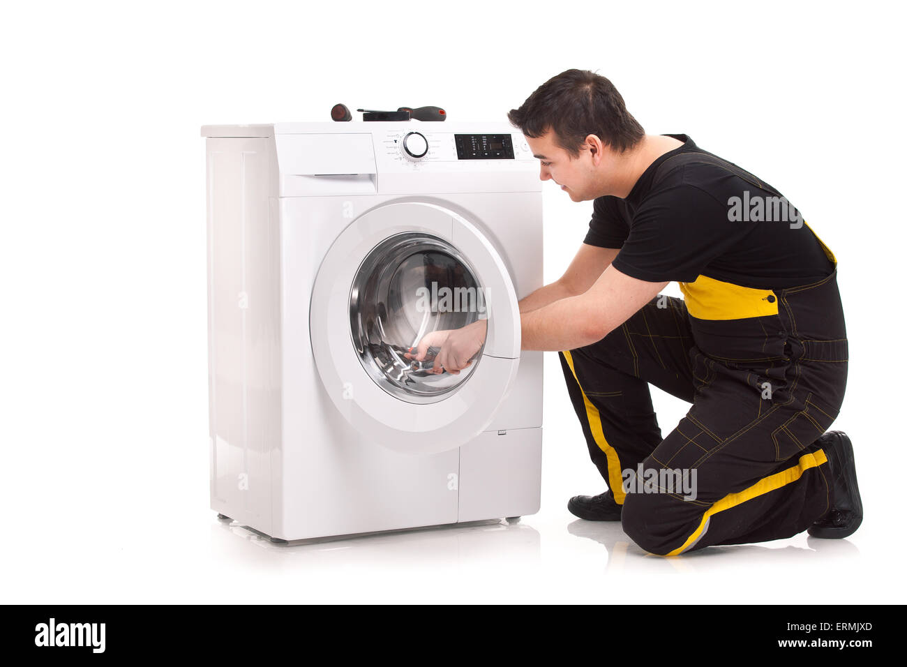 studio photo of washing machine repairman Stock Photo - Alamy