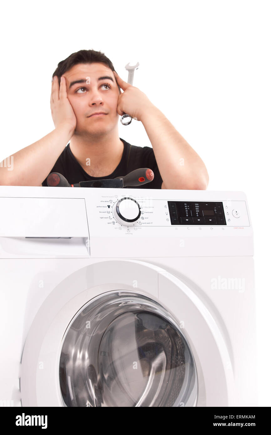 studio photo of washing machine repairman Stock Photo - Alamy
