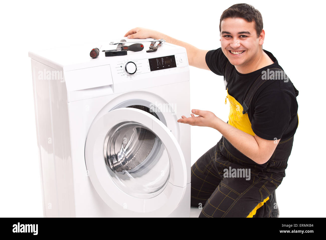 studio photo of washing machine repairman Stock Photo - Alamy
