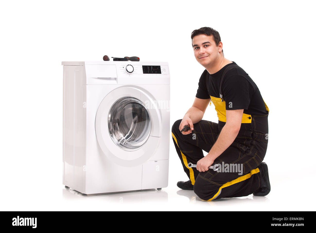 studio photo of washing machine repairman Stock Photo - Alamy