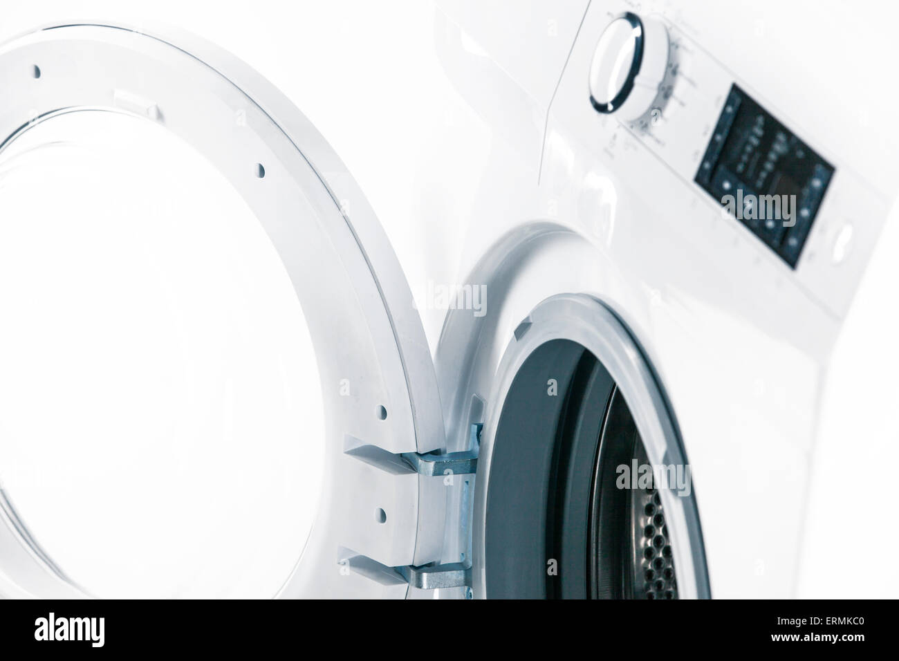 Washing machine with an open door detail on white background Stock ...