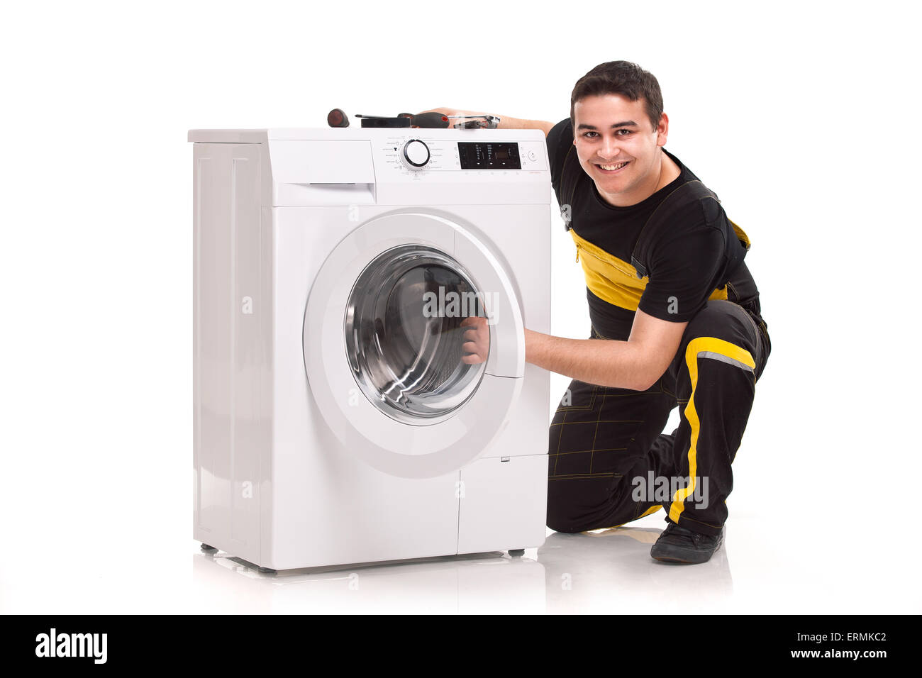 studio photo of washing machine repairman Stock Photo - Alamy