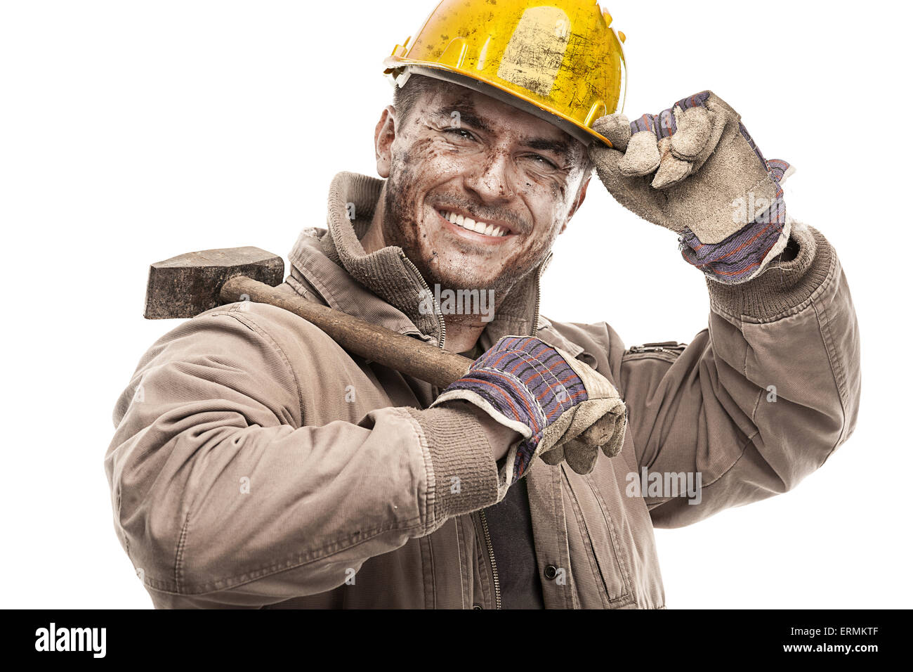 Young dirty Worker Man With Hard Hat helmet holding a hammer and ...