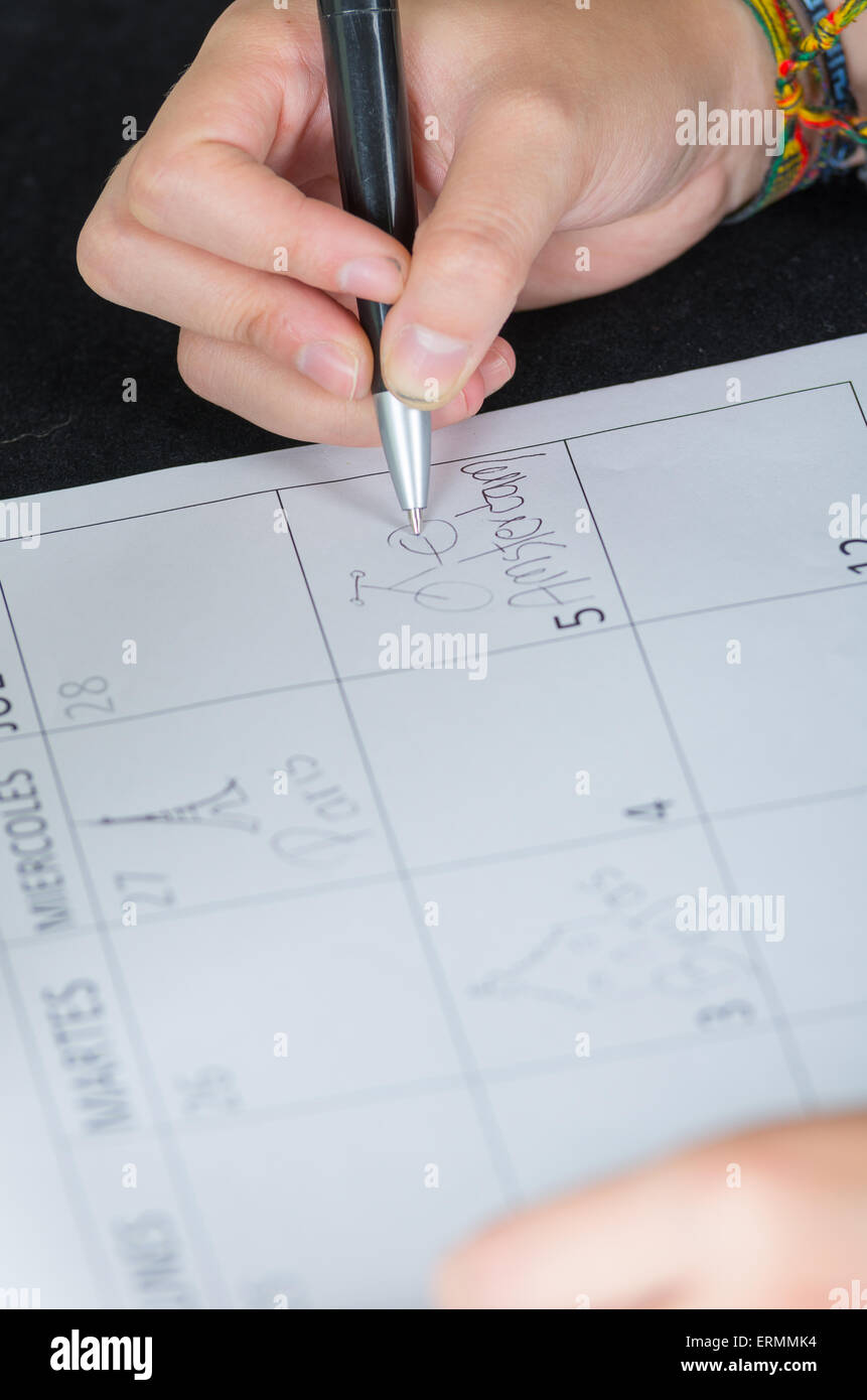 hand writing on paper calendar Stock Photo - Alamy