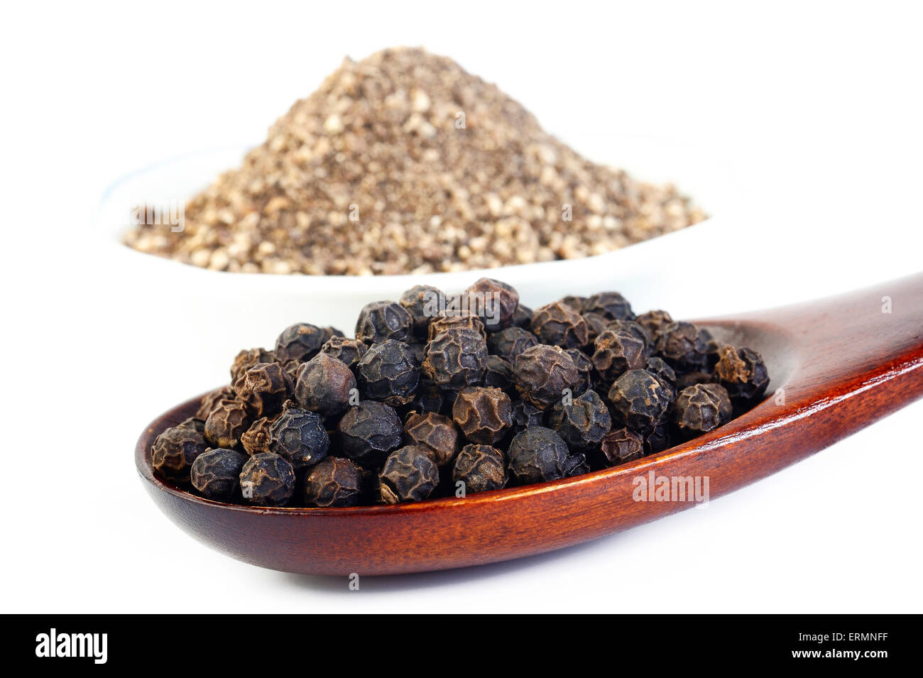 Black pepper in wooden spoon Stock Photo - Alamy