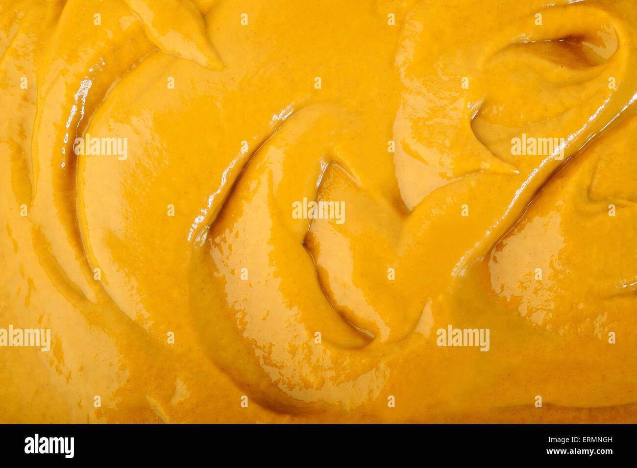 Mustard sauce background Stock Photo - Alamy
