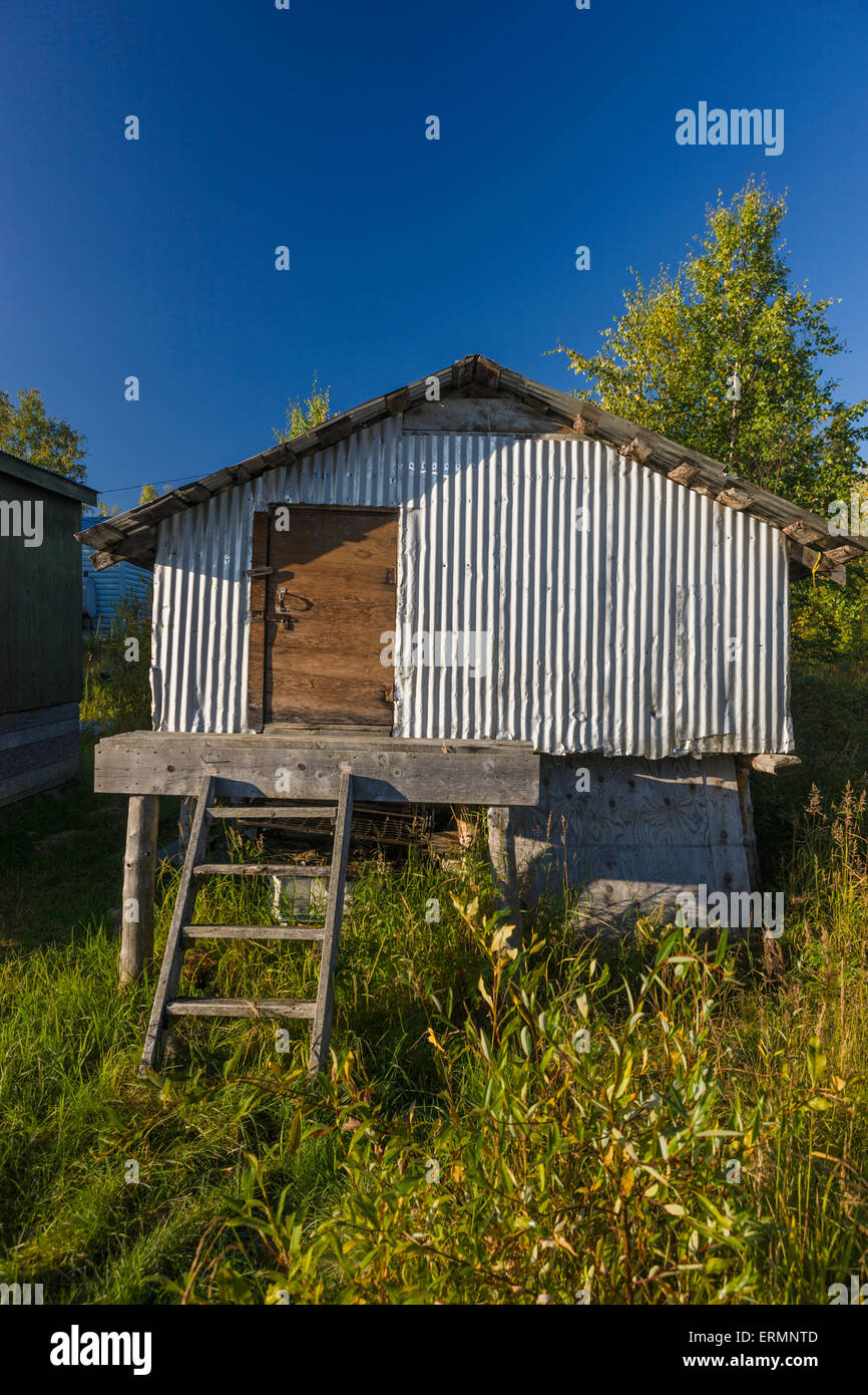 View of the front door of a bear cache with silver metal corrugated ...