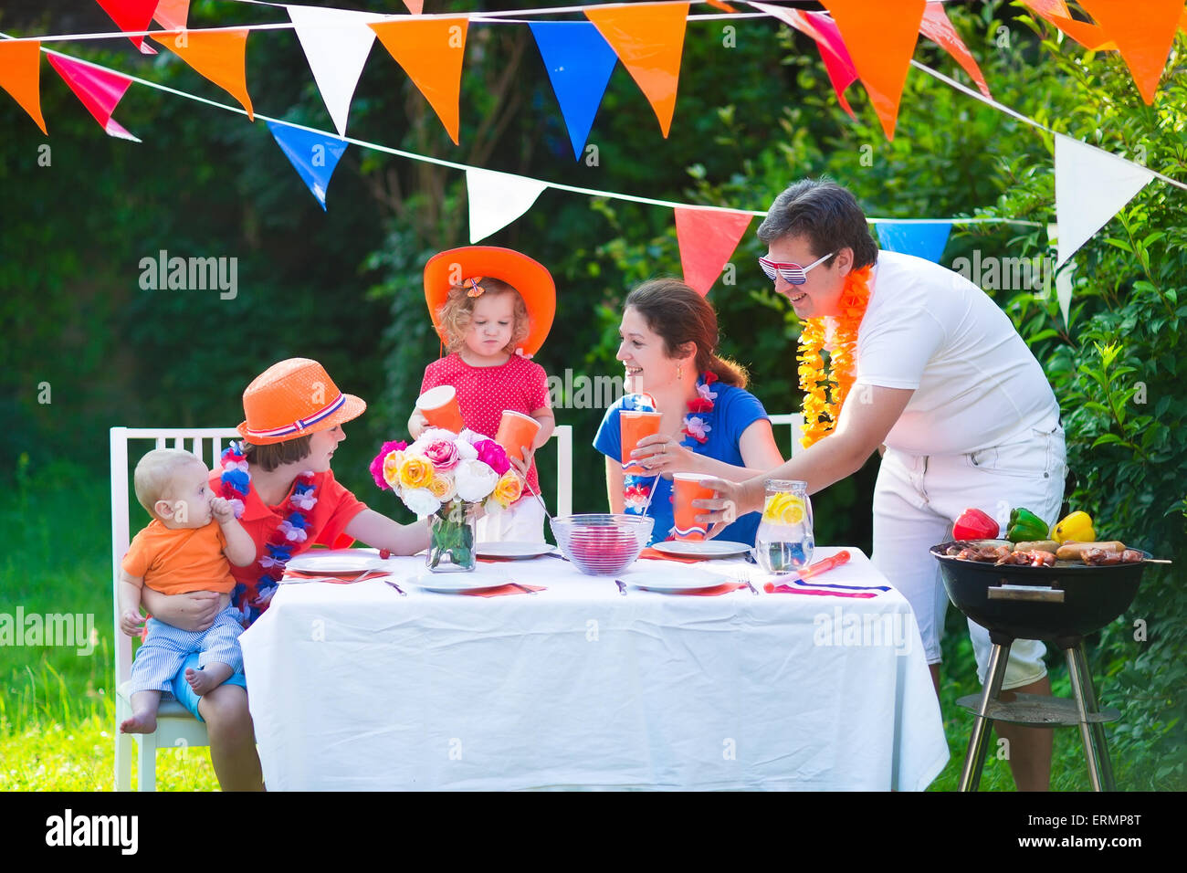 Big Dutch family with kids celebrating national holiday or sport ...