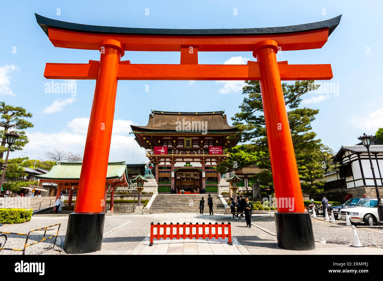 The large vermilion torii gate in front of the main gate, Romon, into ...