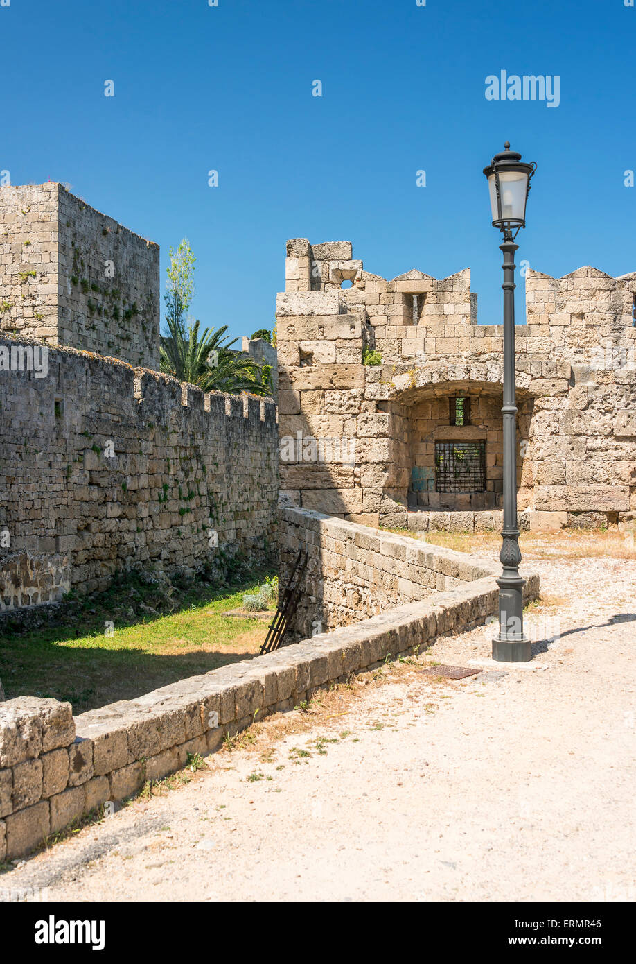 The old medieval castle walls as seen from the moat on the Greek island ...