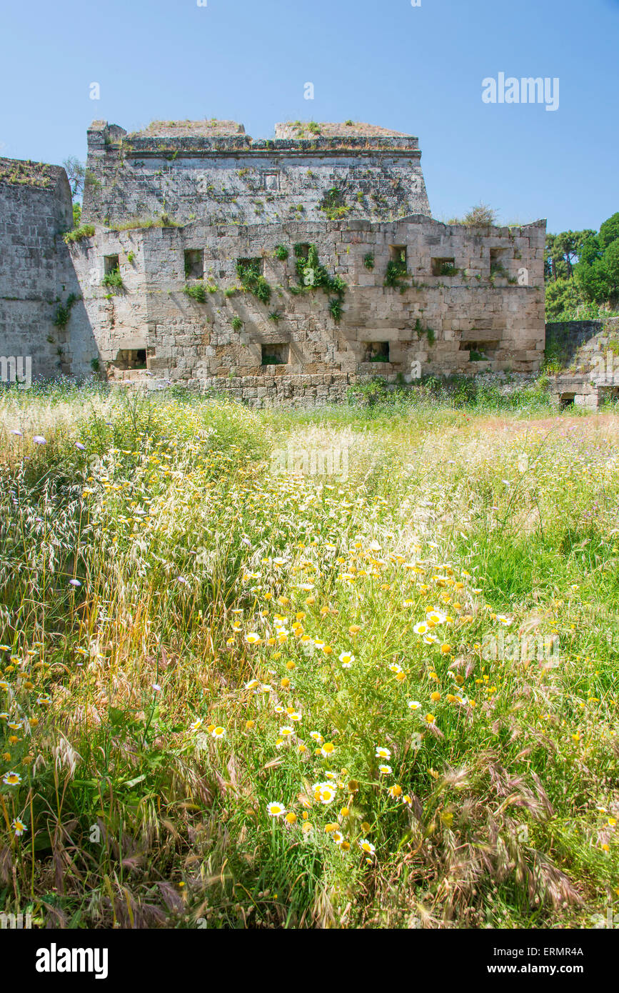 The old medieval castle walls as seen from the moat on the Greek island ...